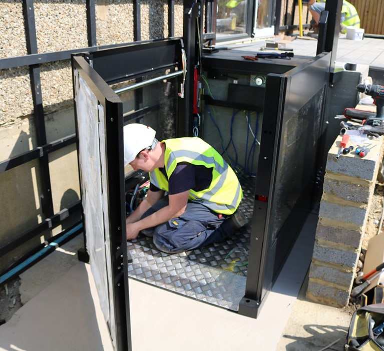 Terry-Lifts-lift-engineer-installing-a-mobility-lift_767x706