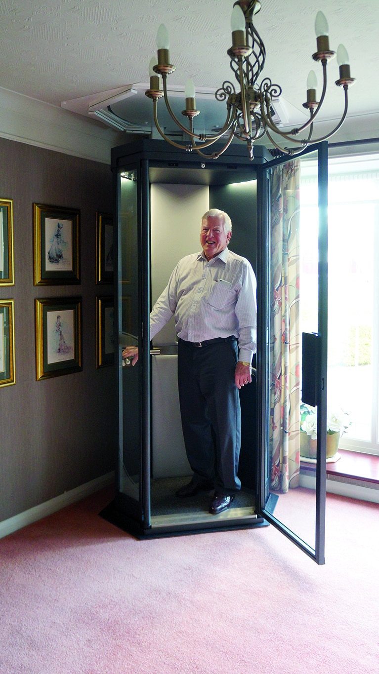 Mr-K-Standing-in-Black-Lifestyle-Lift-Living-Room